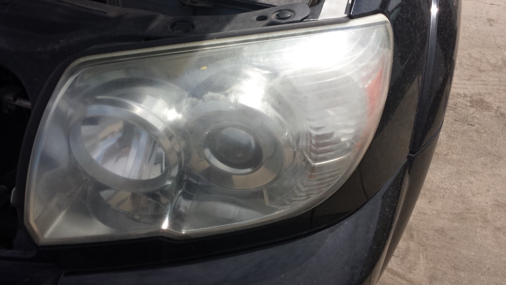 Before Restored Headlight - Best Auto Glass Repair & Replacement
